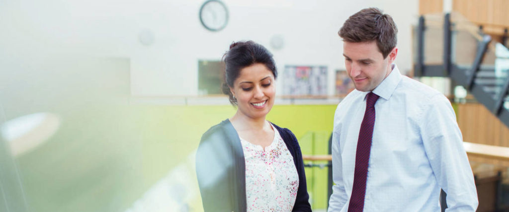 Two teachers talking - Character Education Trust